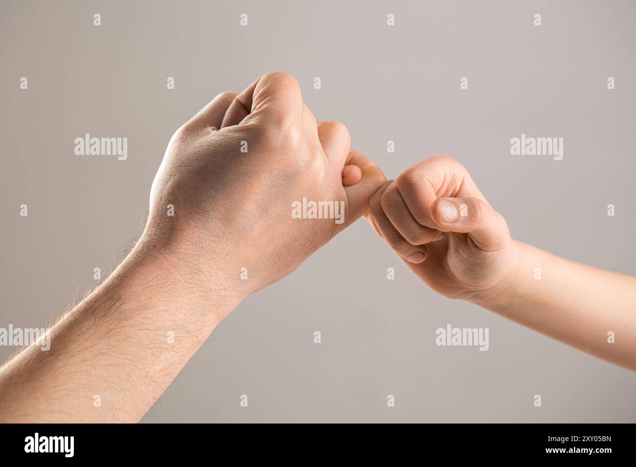 The gesture of the hands mean promise. Friendship concept. Father and ...