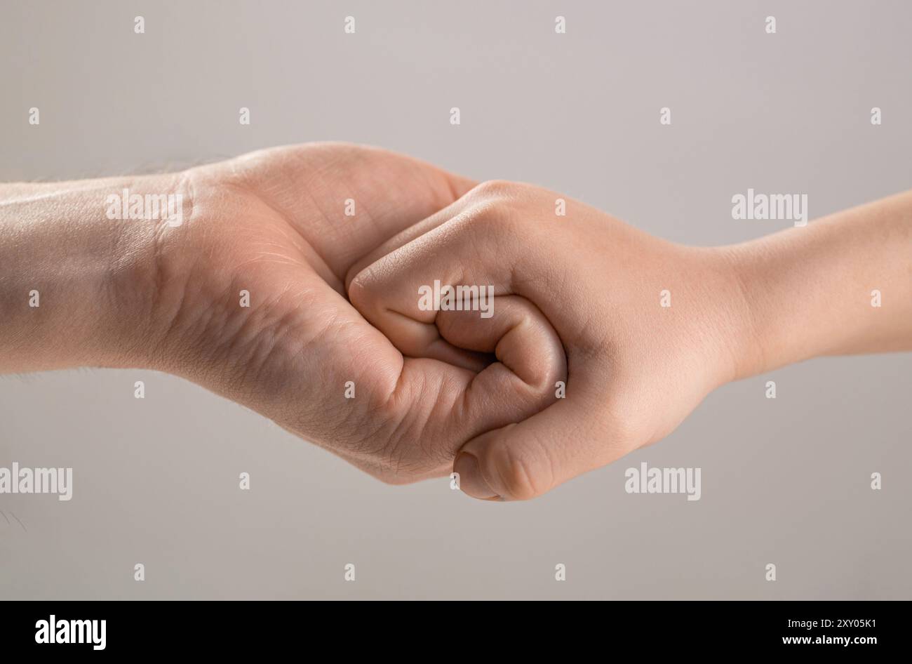 Male and child hands connected each other together and forever ...
