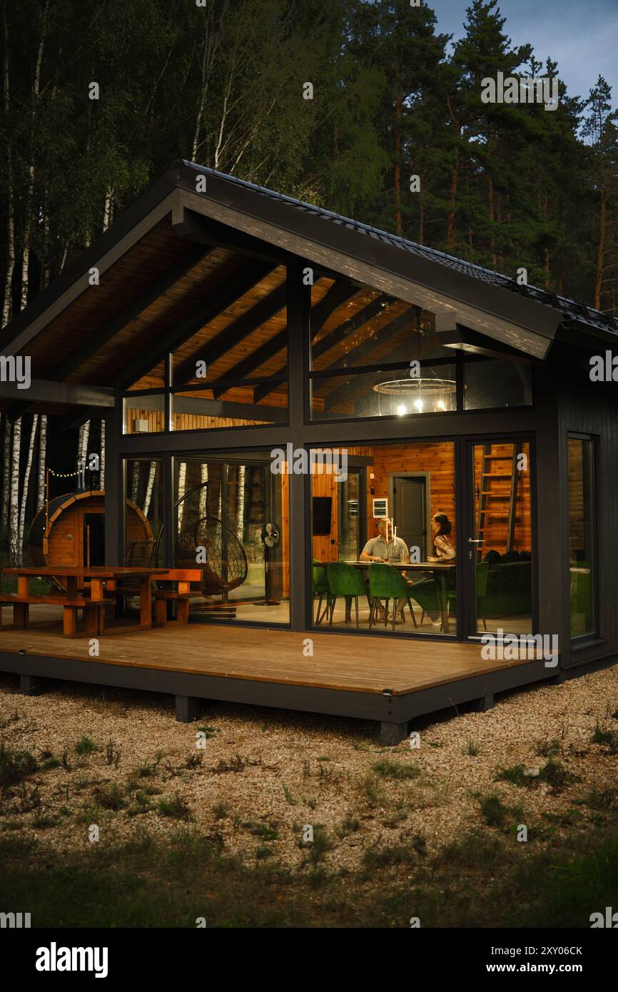 Woman in cozy modern cabin hi-res stock photography and images - Alamy
