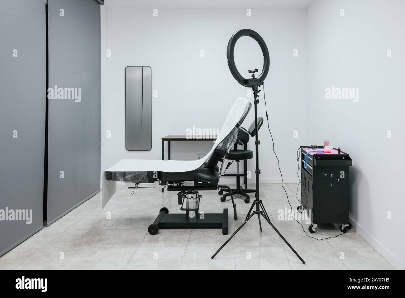 Clean and professional microblading studio setup with a work chair and ...