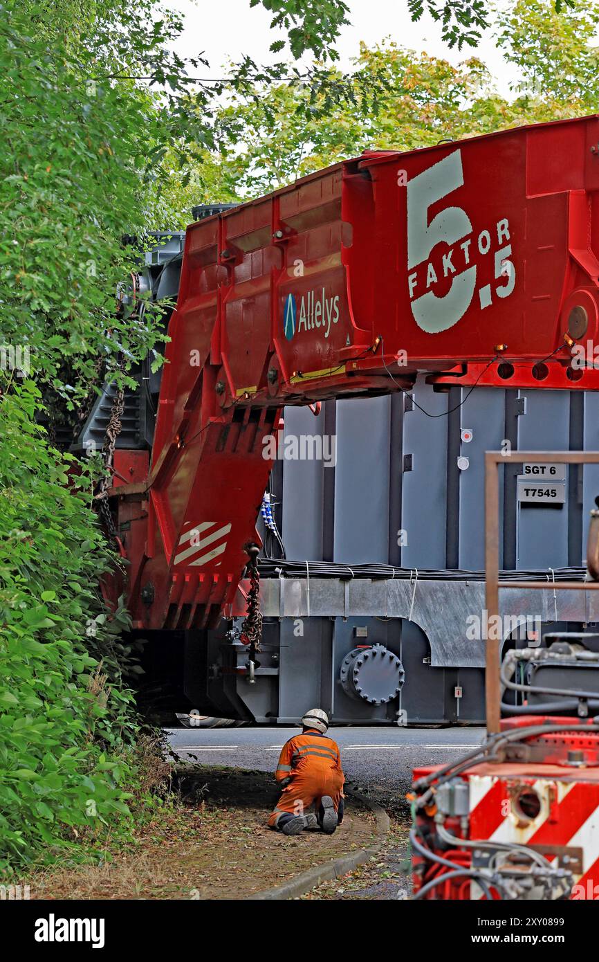 One of Alleys heavy haulage team is on his knees checking there is ...