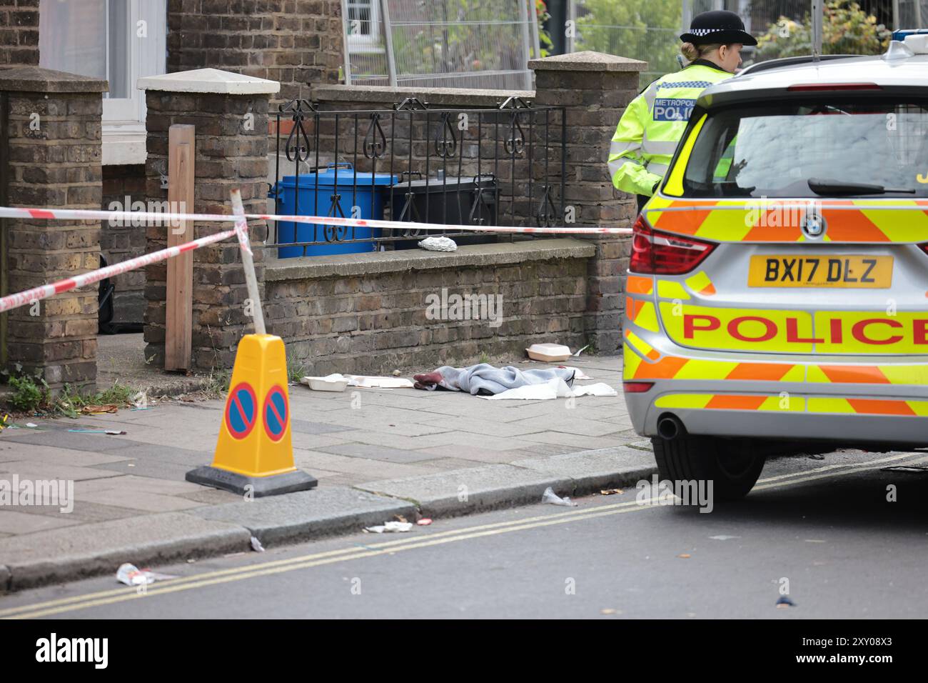 27/08/2024. London, UK. A blood soaked jumper at a crime scene in place ...