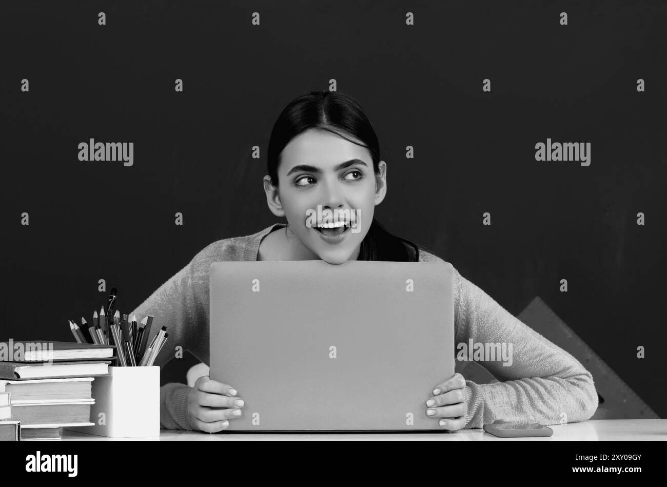 The student girl is studying in the classroom. Student teenager girl ...