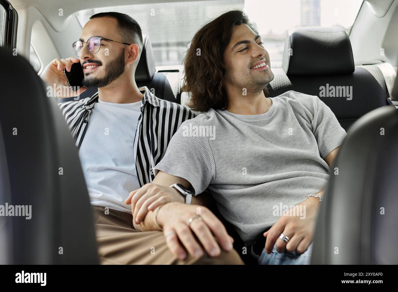 Couple hold hands in car hi-res stock photography and images - Alamy