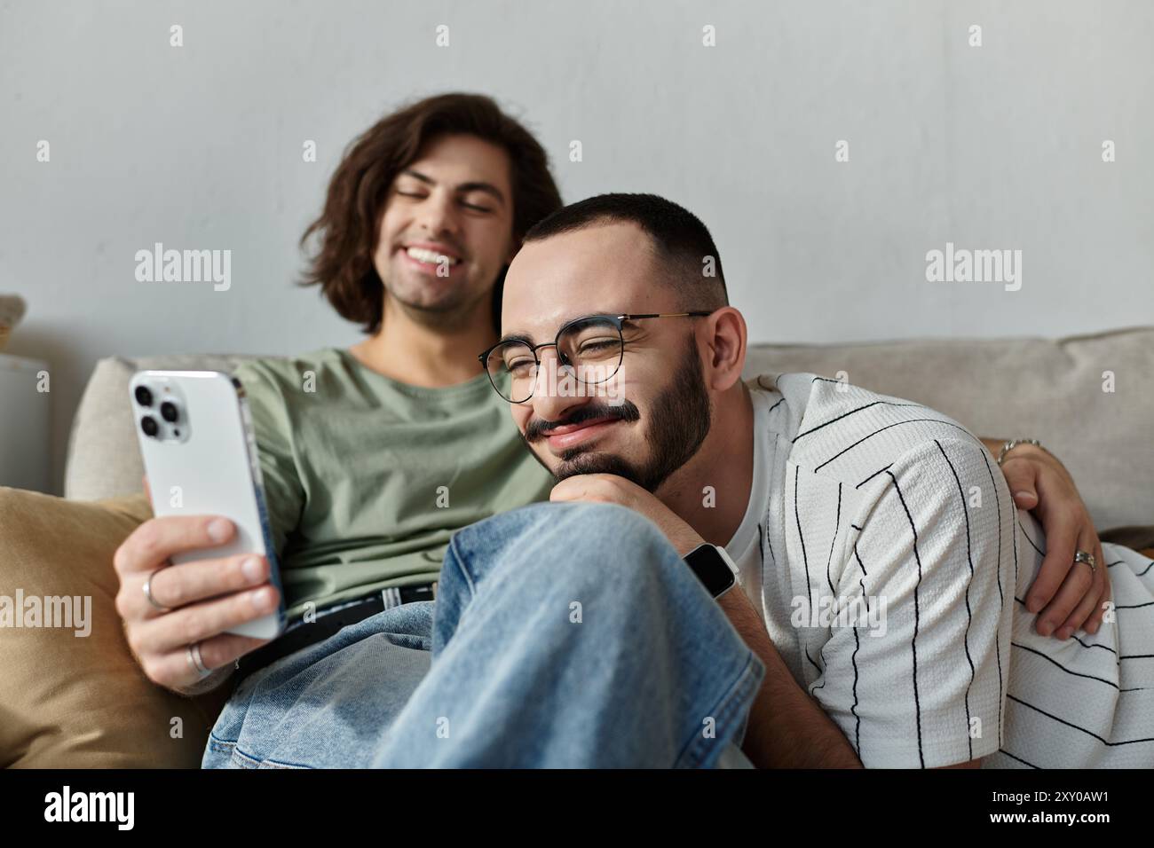 Happy gay couple cuddling on hi-res stock photography and images - Alamy