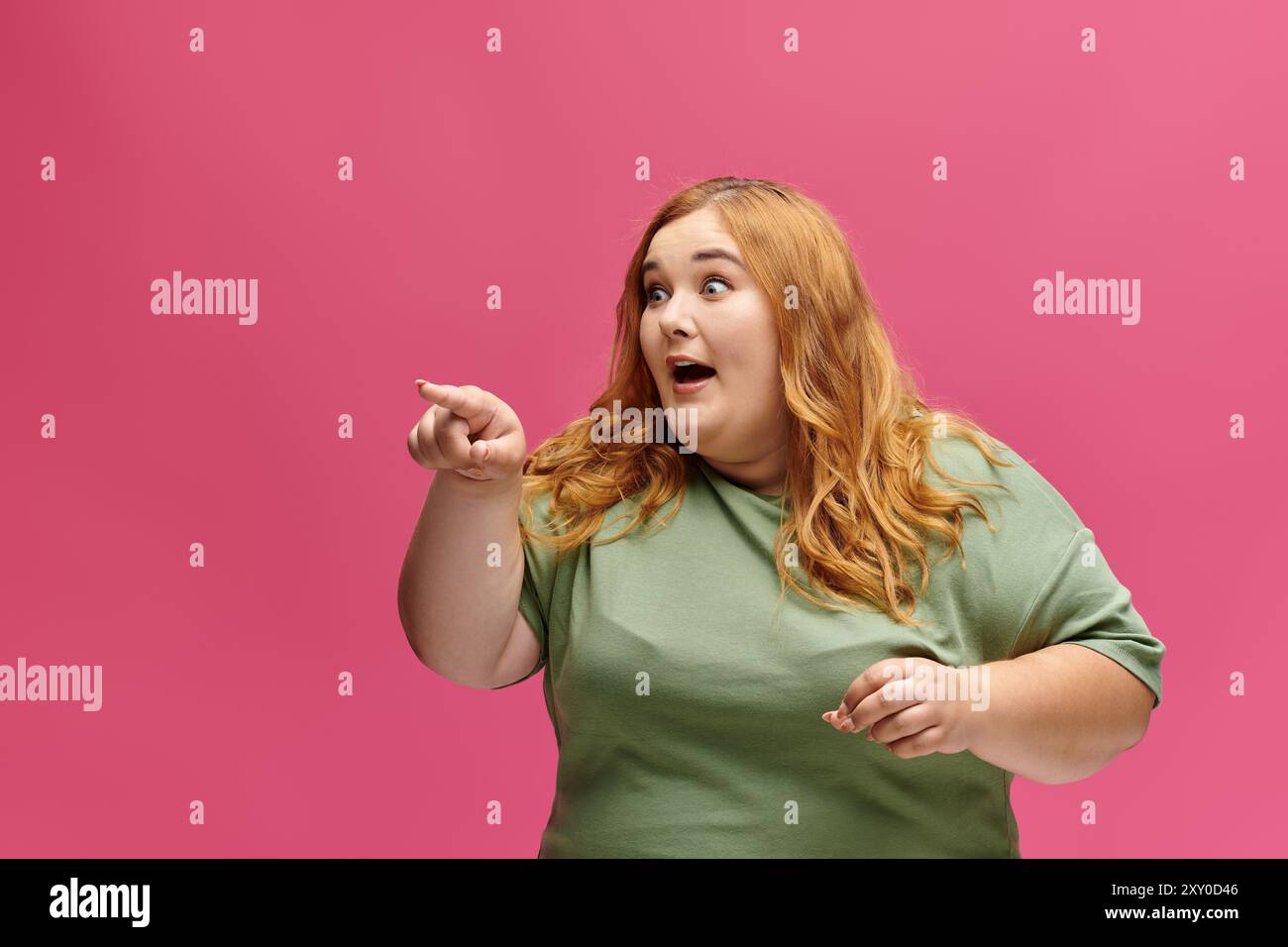 Plus size woman points hi-res stock photography and images - Alamy