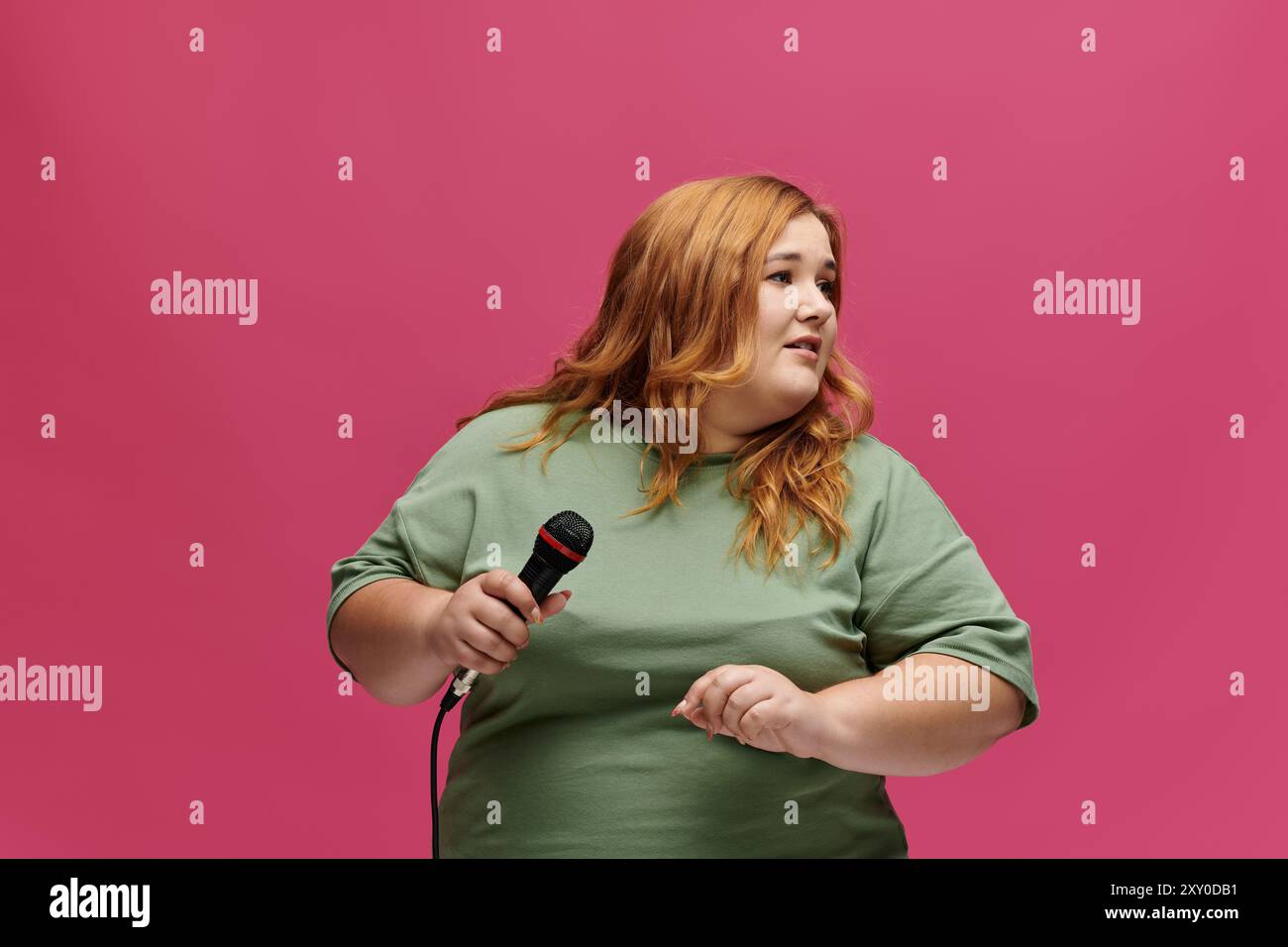 Beautiful woman standing microphone hi-res stock photography and images ...