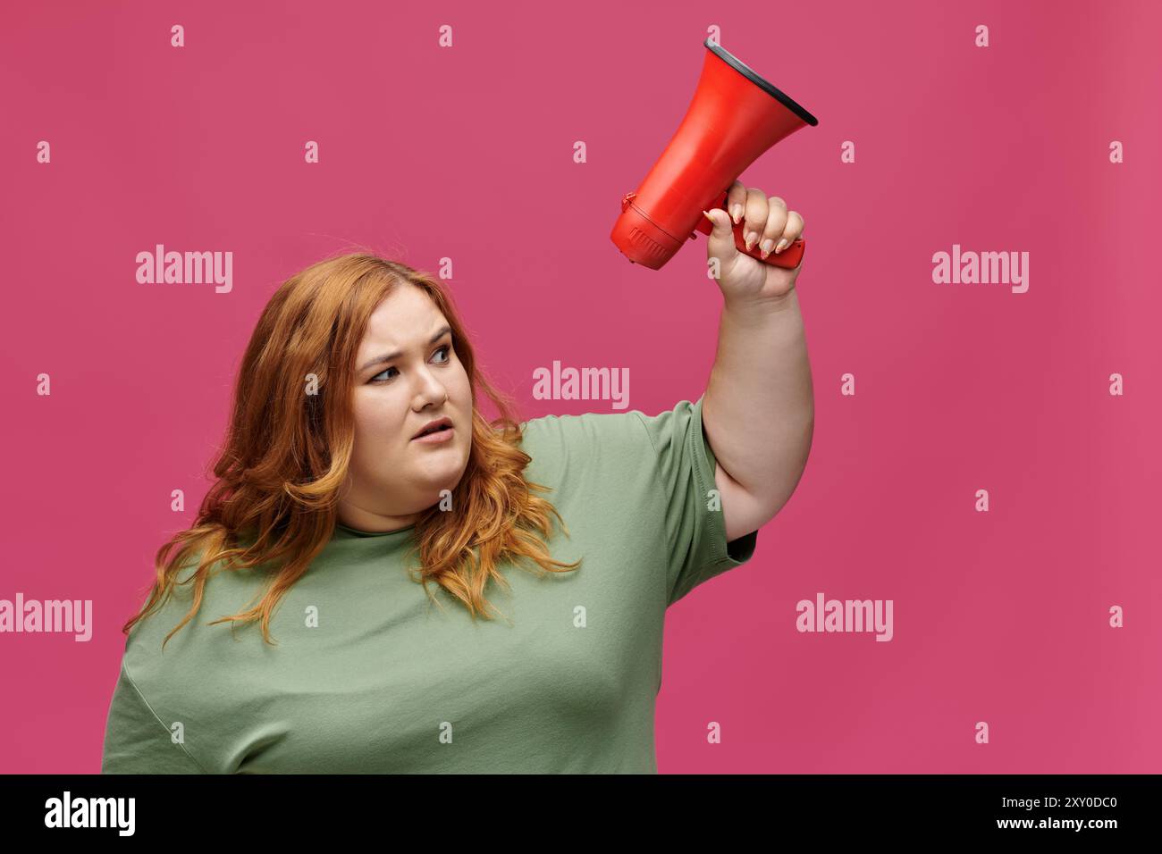 Woman determined expression holds hi-res stock photography and images ...