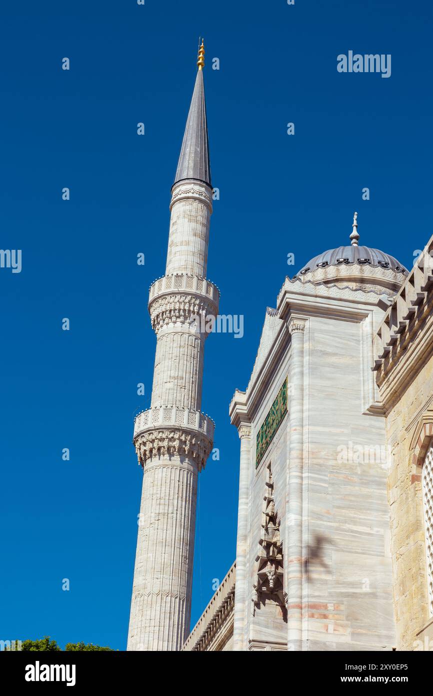 Minaret and main gate of Sultanahmet Mosque or Blue Mosque vertical ...