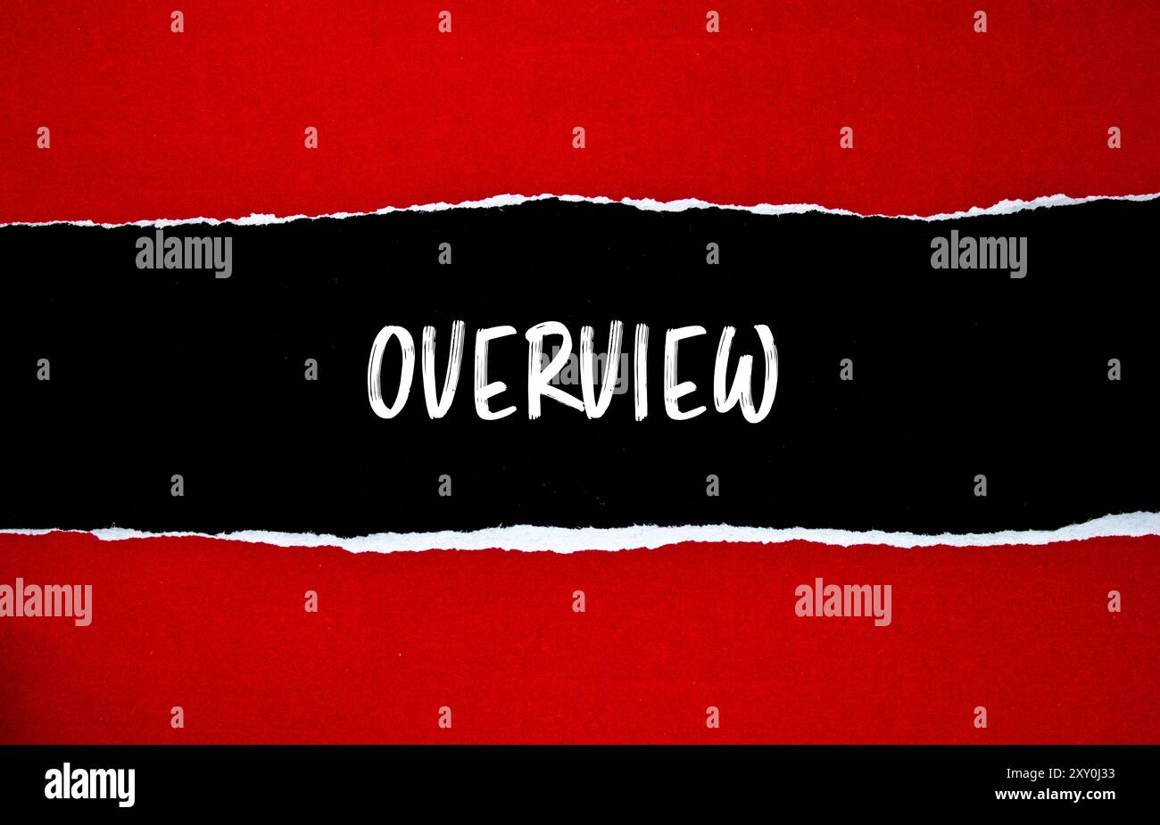 Overview message written on ripped torn red paper with black background. Conceptual overview ...