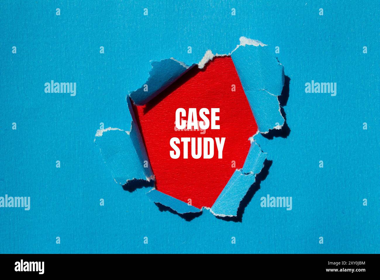 Case study message written on ripped torn blue paper with red background. Conceptual case study ...