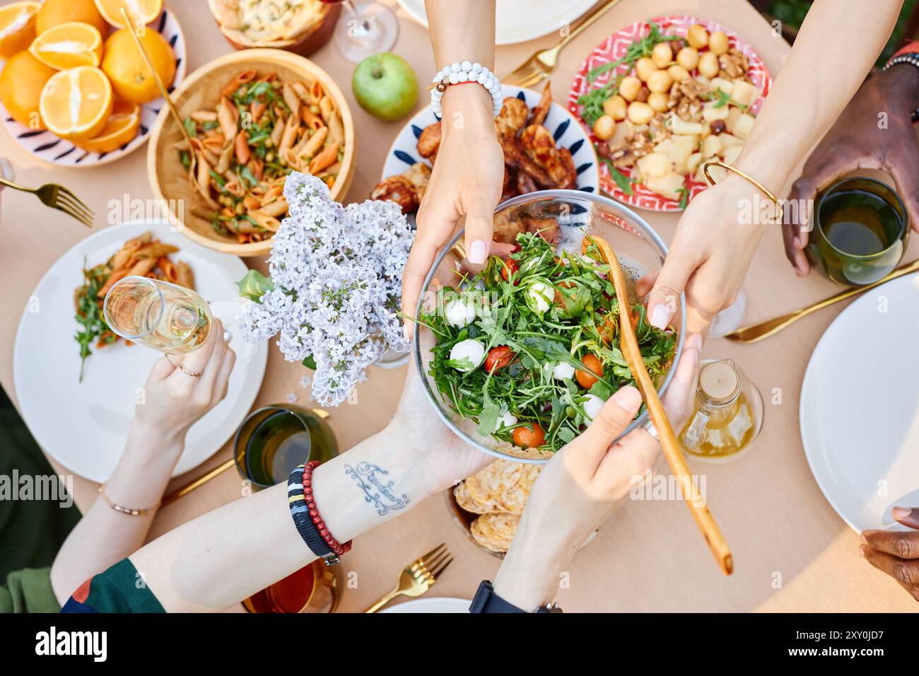 Table filled with variety of Mediterranean dishes being served, showing ...