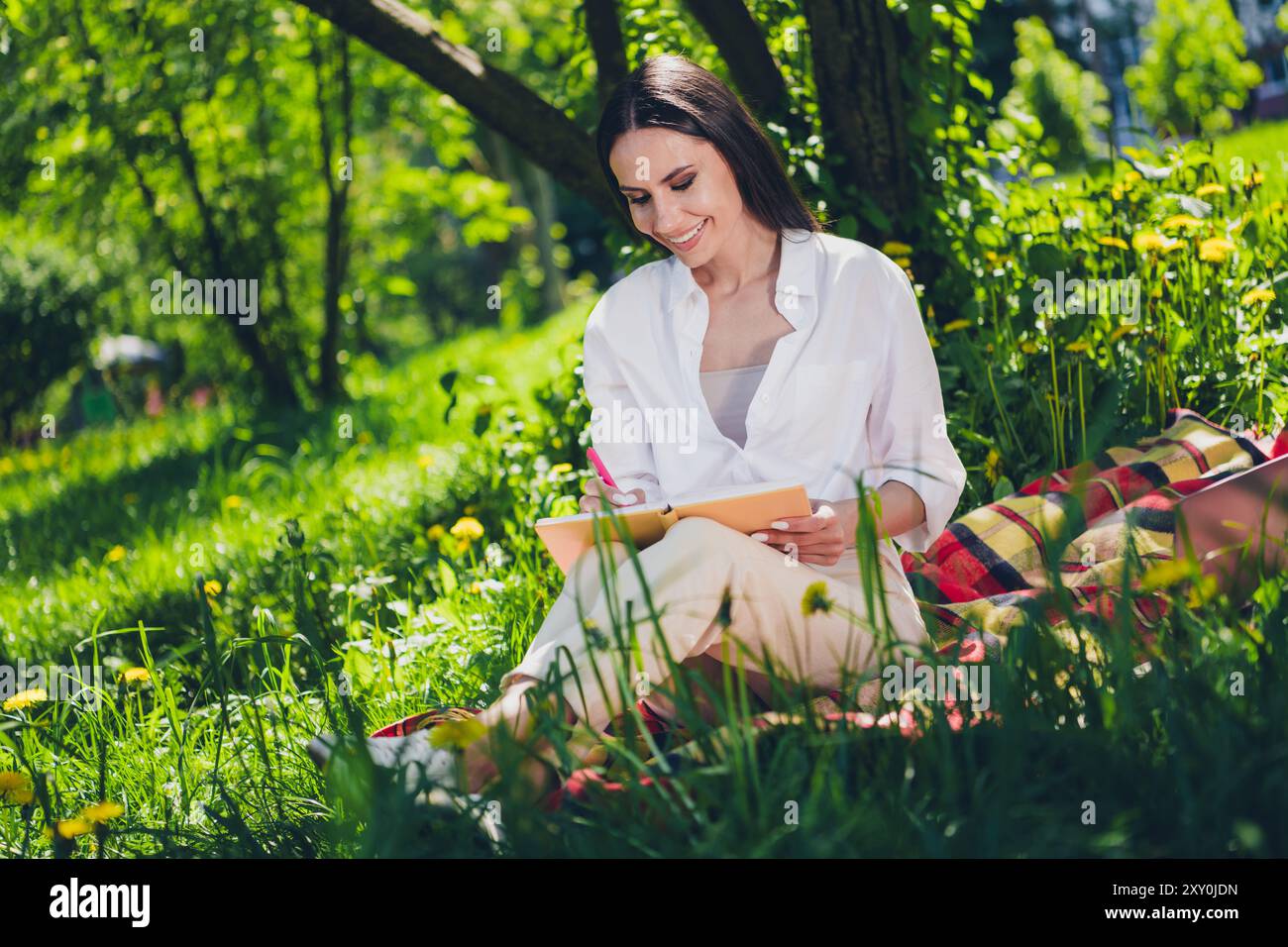 Full size photo of attractive young cheerful girl sit picnic plaid ...