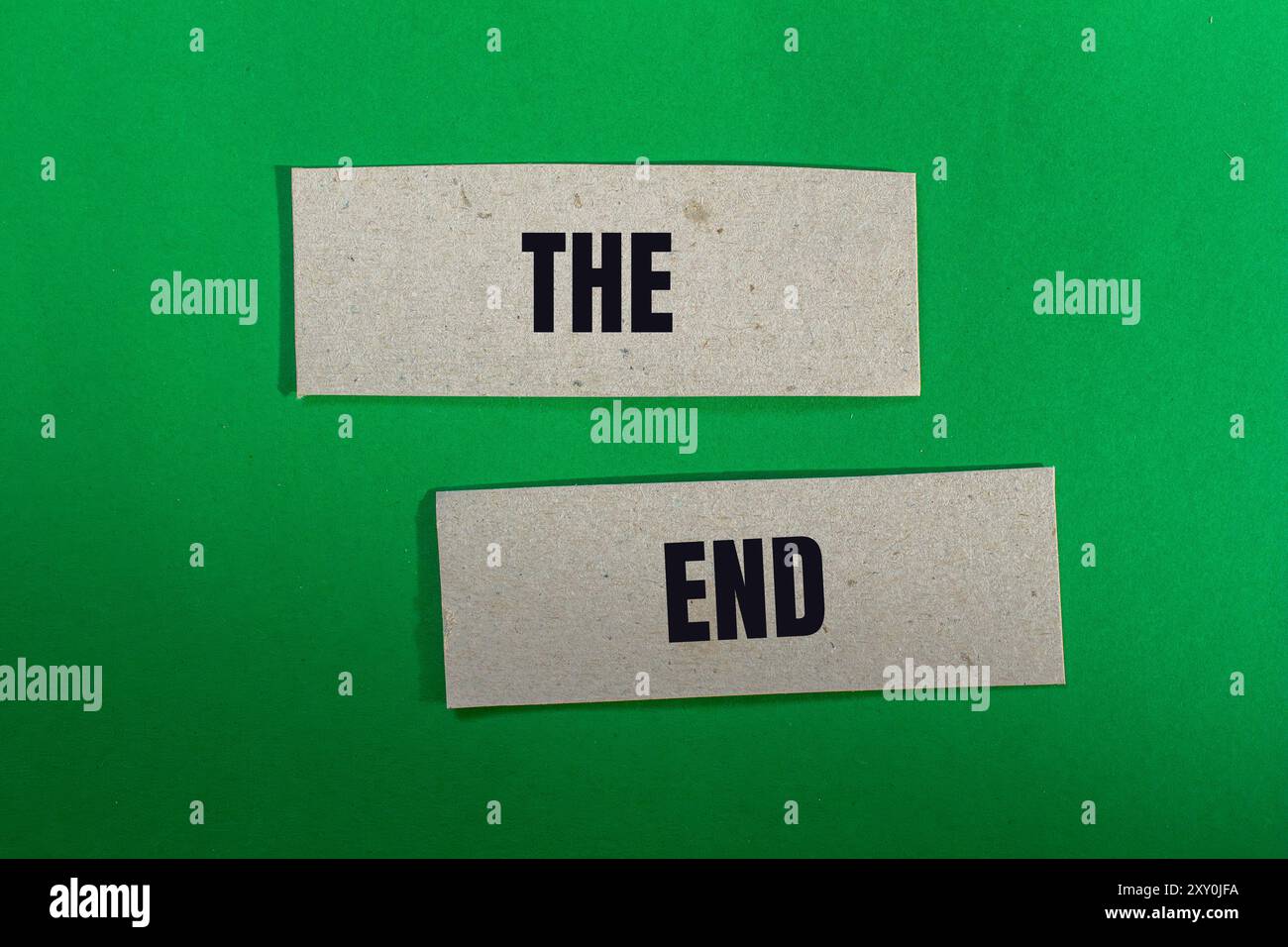 The end message written on paper pieces with green background ...