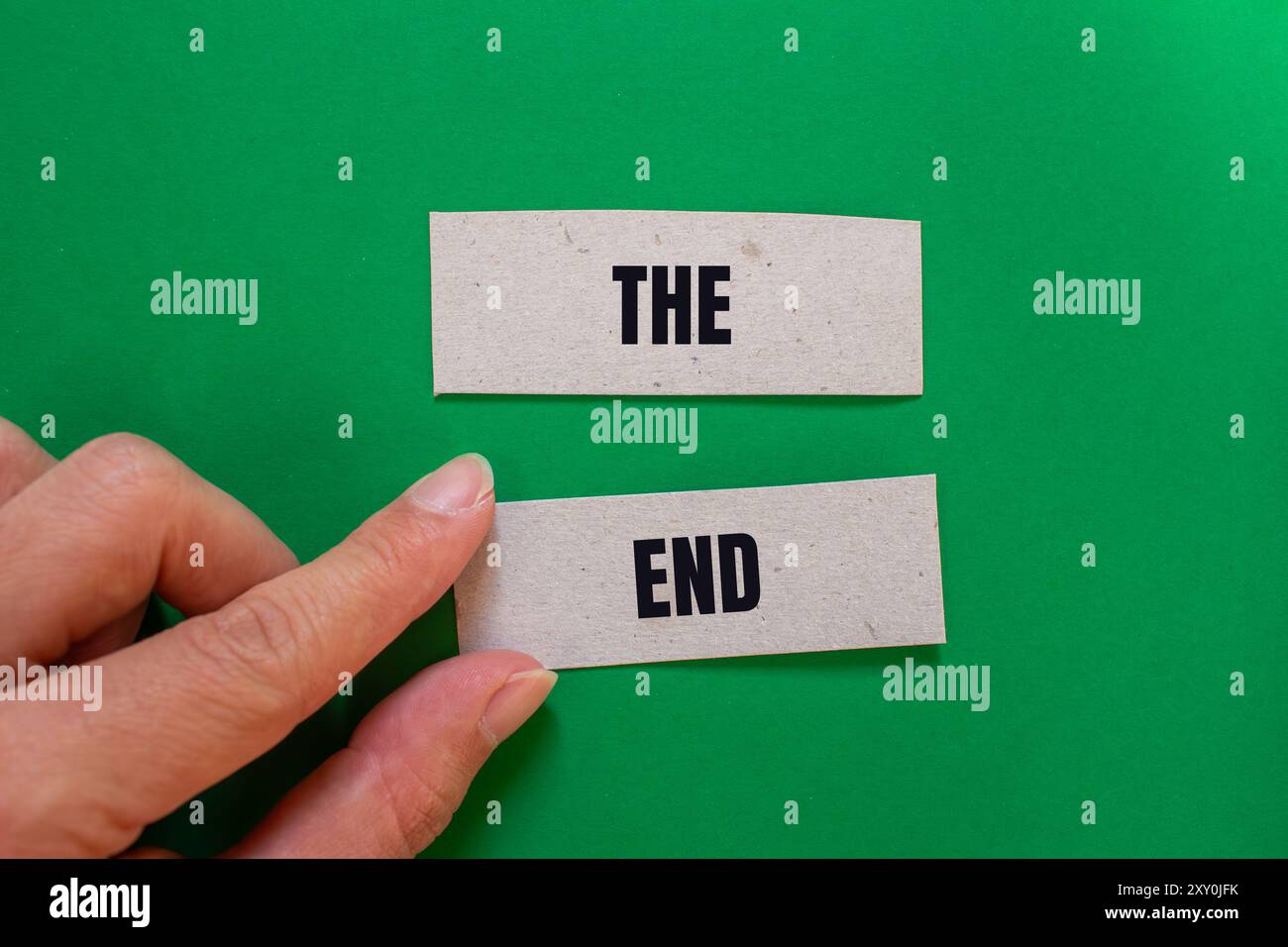The end message written on paper pieces with green background ...