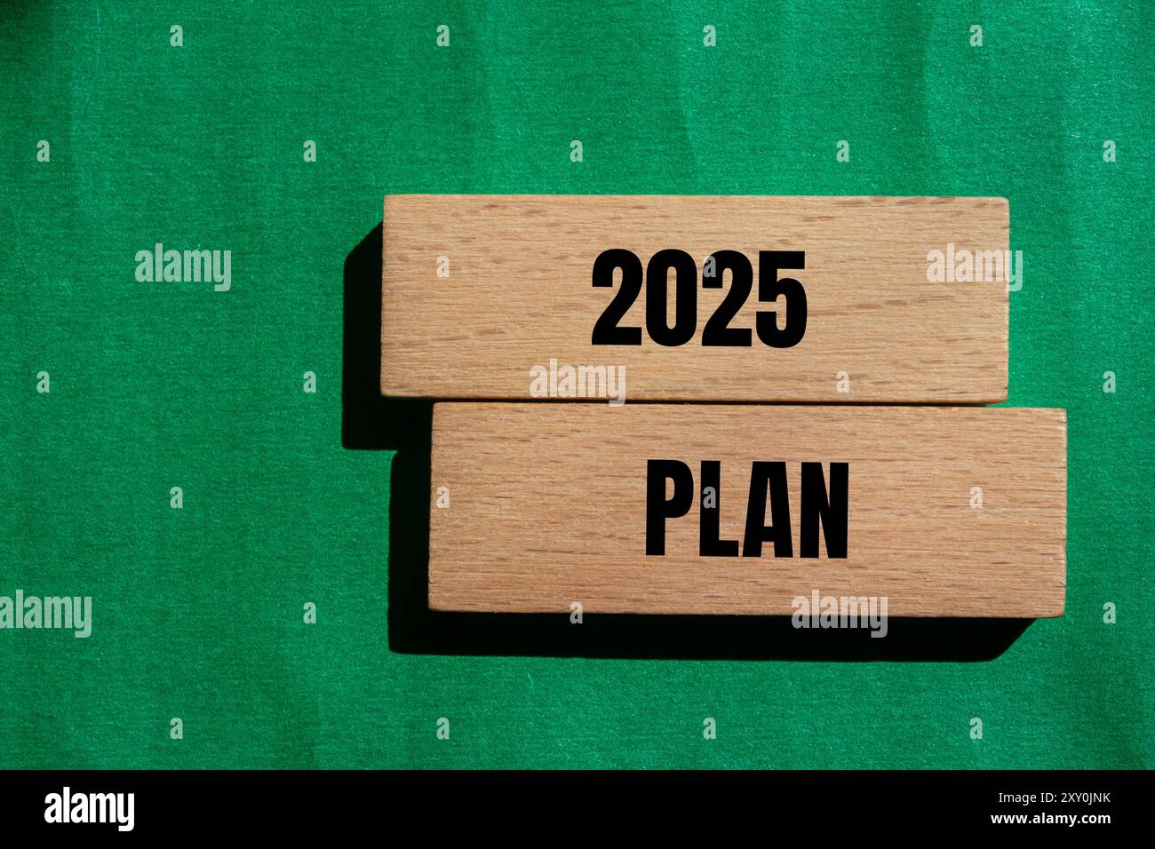 2025 plan message written on wooden blocks with green background ...