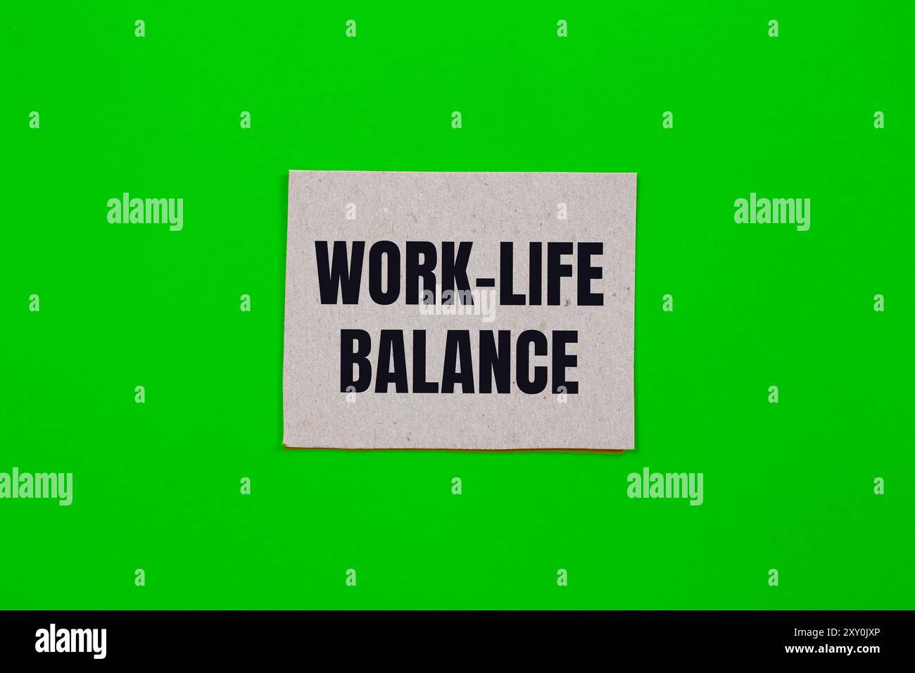 Work life balance message written on paper piece with green background ...