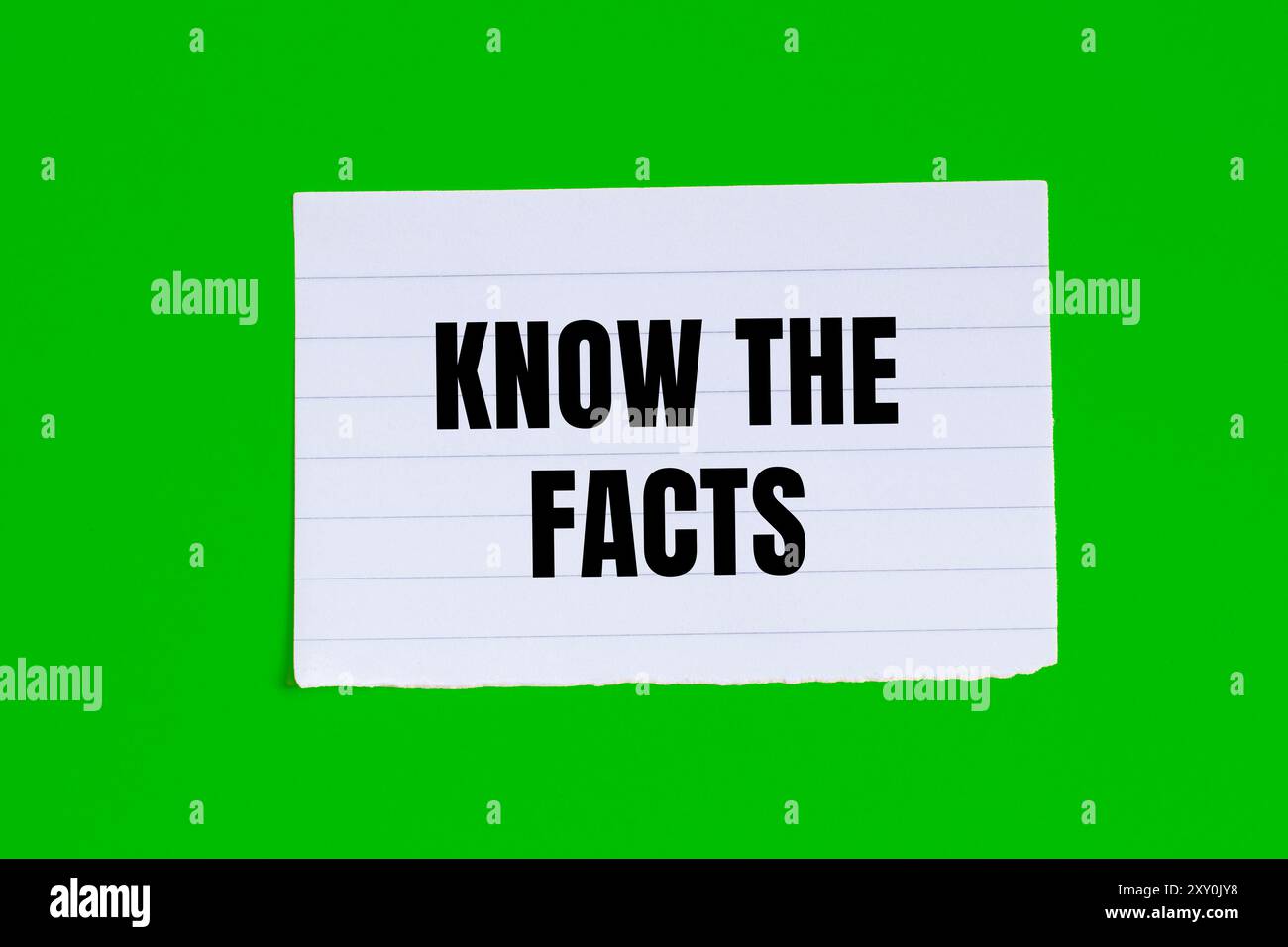 Know the facts message written on ripped torn paper piece with green ...