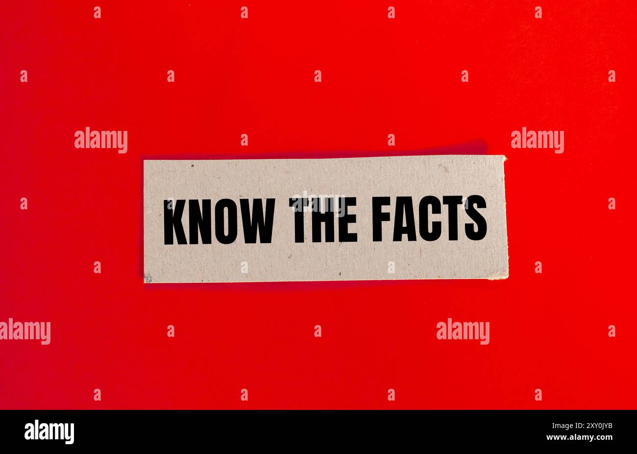 Know the facts message written on paper piece with red background ...