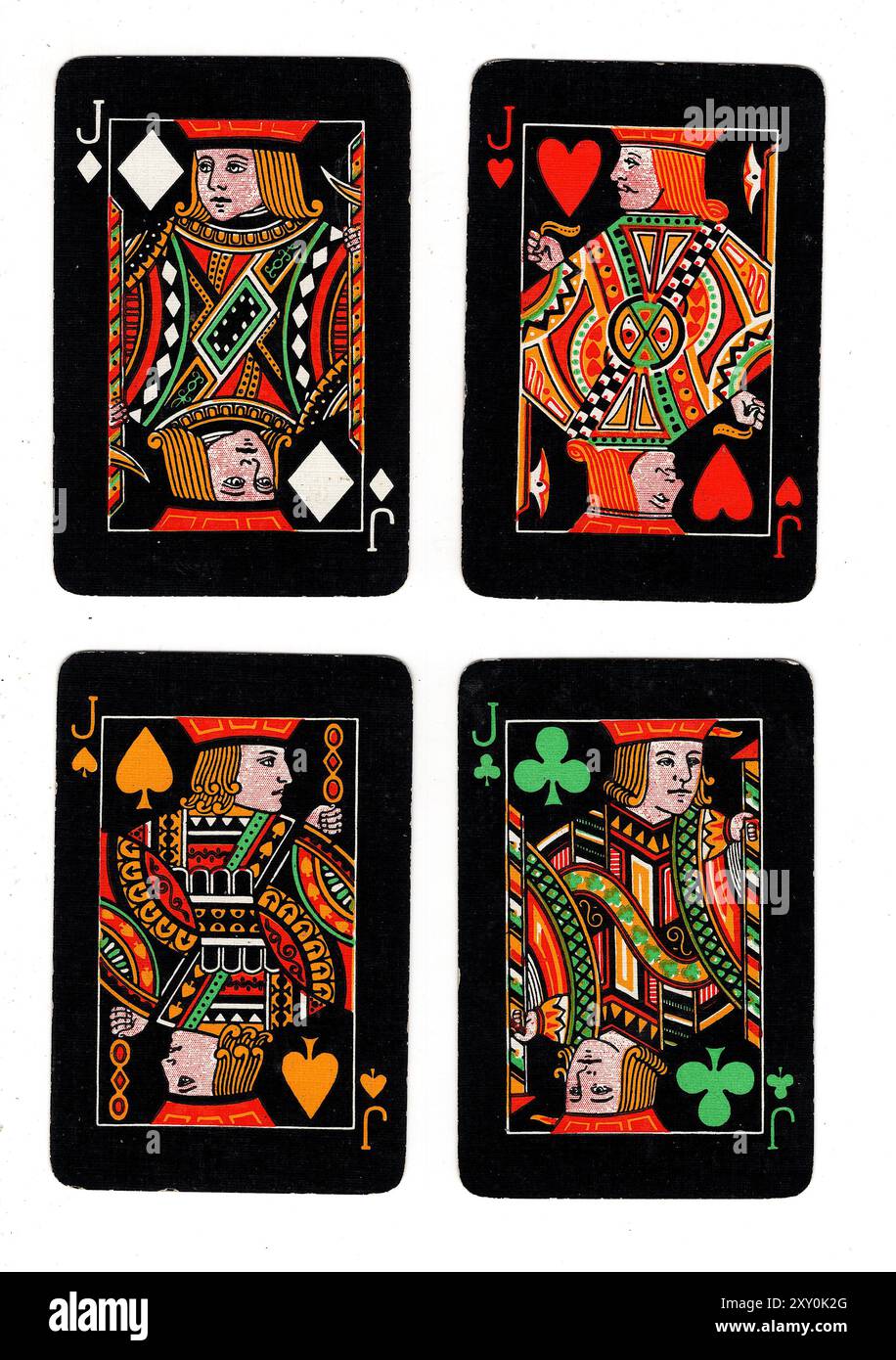 Vintage black playing cards showing four jacks on a white background ...