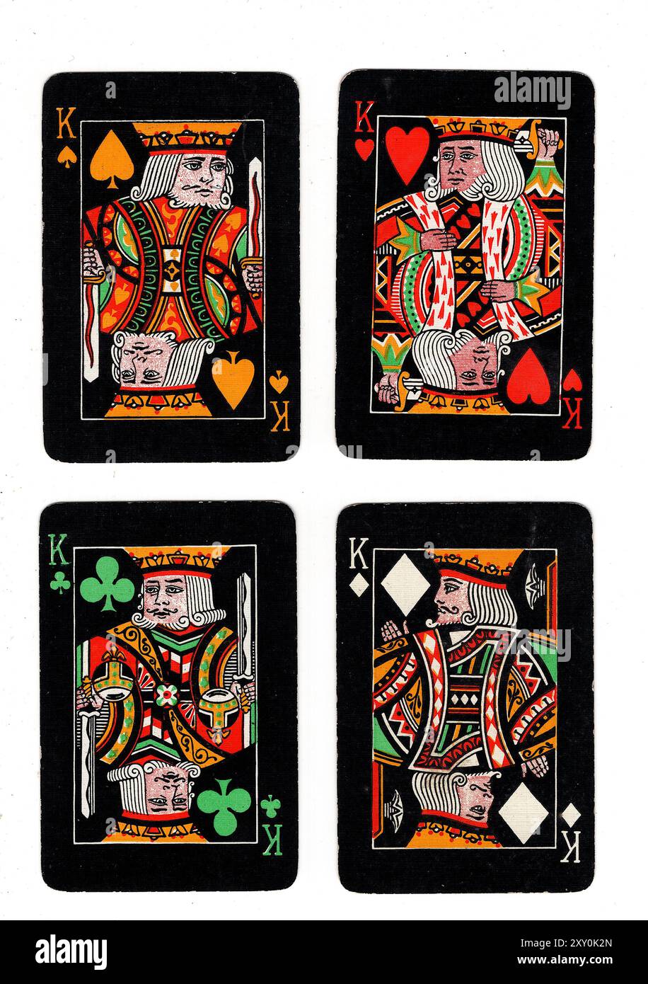 Vintage black playing cards showing four kings on a white background ...