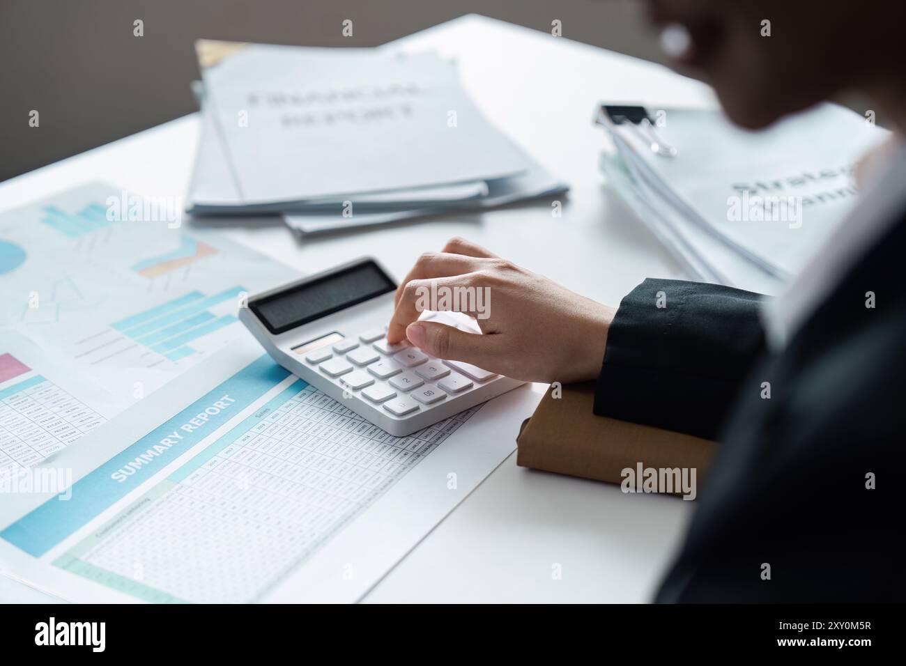 Business Accountant Working on Financial Reports with Calculator and ...