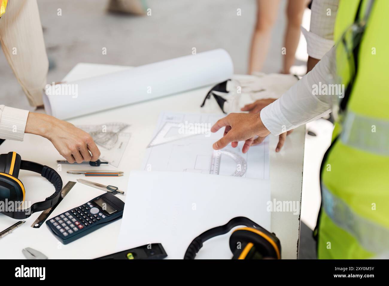 Architect collaboration on Construction Plan at a Worksite with ...