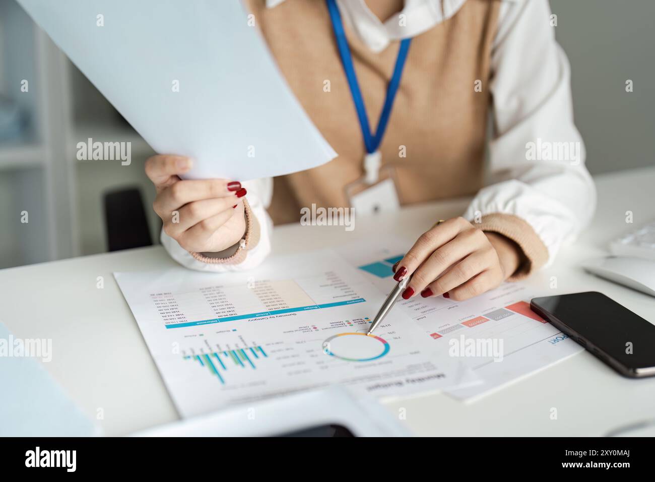 Professional Businesswoman analysis Financial Report and Data in a ...