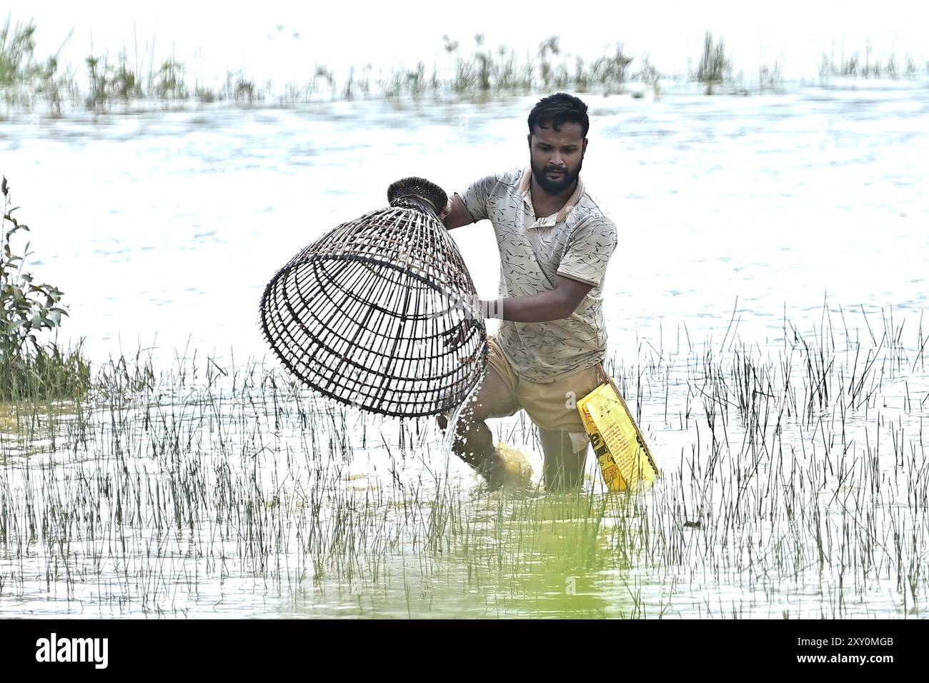 Indian boys fishing in river hi-res stock photography and images - Alamy