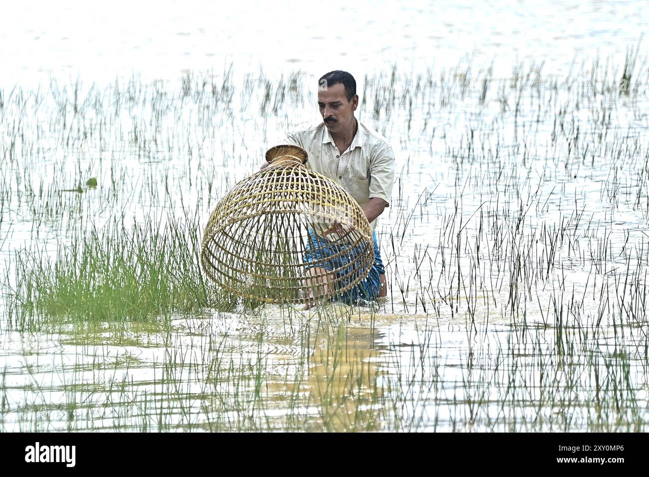 Indian boys fishing in river hi-res stock photography and images - Alamy