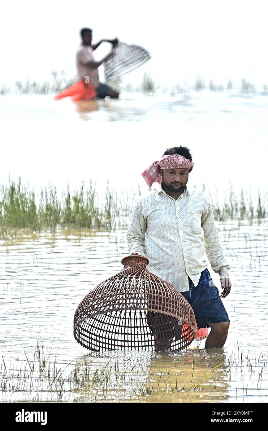 Indian boys fishing in river hi-res stock photography and images - Alamy