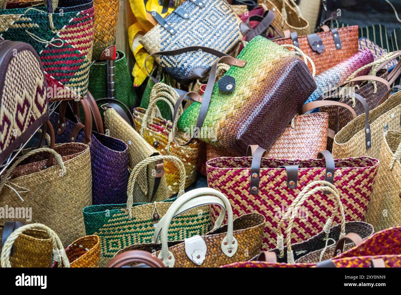 A close-up of handmade Thai straw bags, at Crafts Bangkok 2024, at the ...