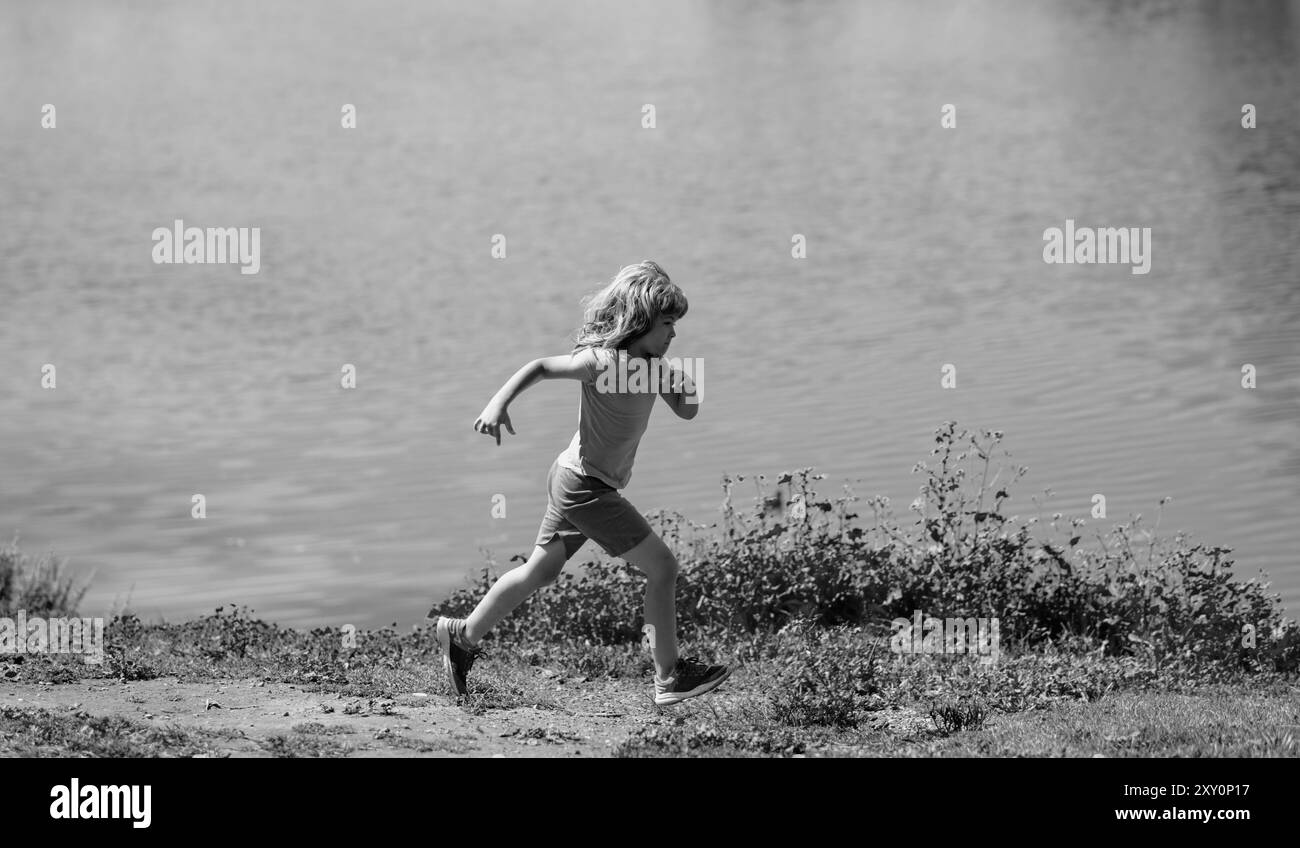 Run and healthy sport for children. Child running on summer park. Kid ...