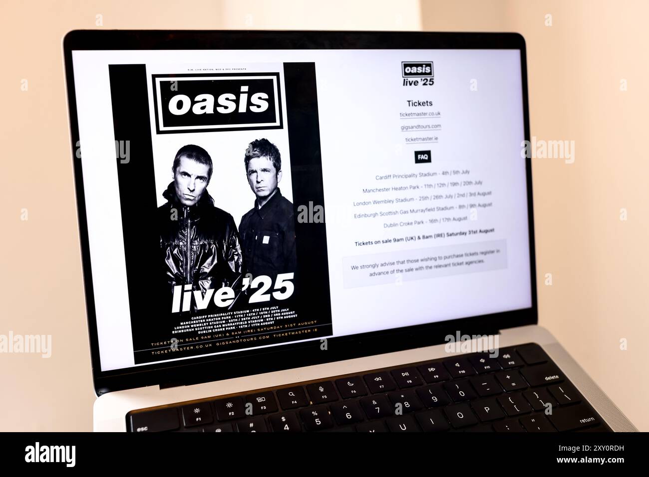 The Oasis website, shown on a computer laptop screen, displays ...