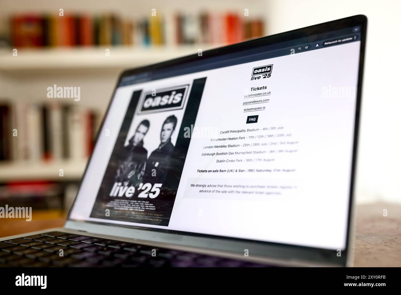 The Oasis website, shown on a computer laptop screen, displays ...
