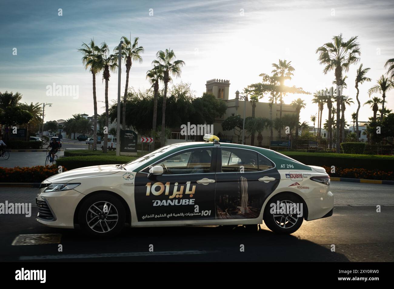 Toyota taxi car driving on an urban road of Dubai. City taxi. Dubai ...