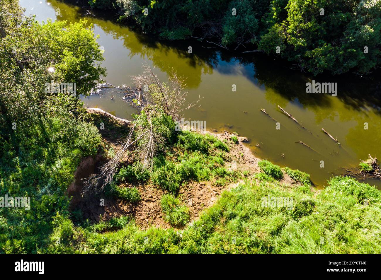 Drone view of an eroded river bank with a landslide Stock Photo - Alamy