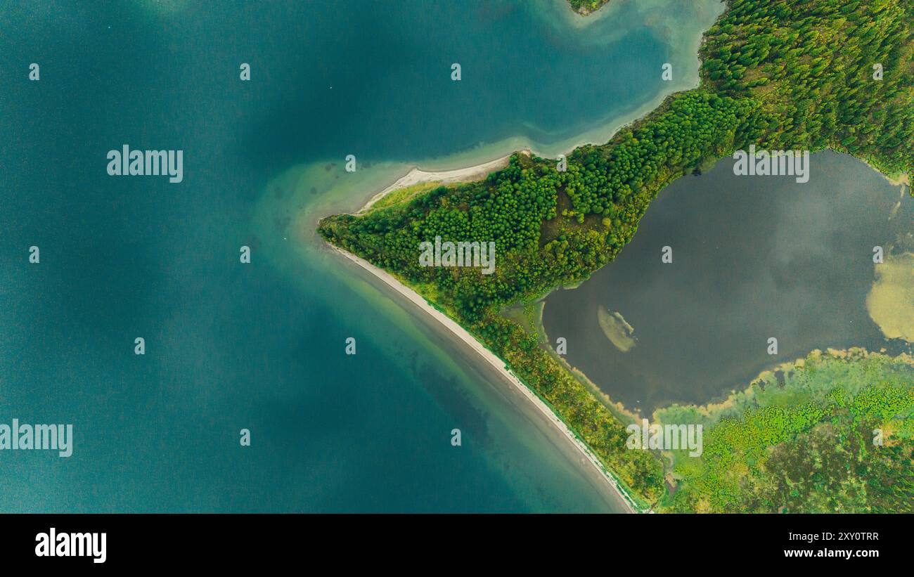 Stunning aerial shot that captures the lush vegetation and sandy shores ...