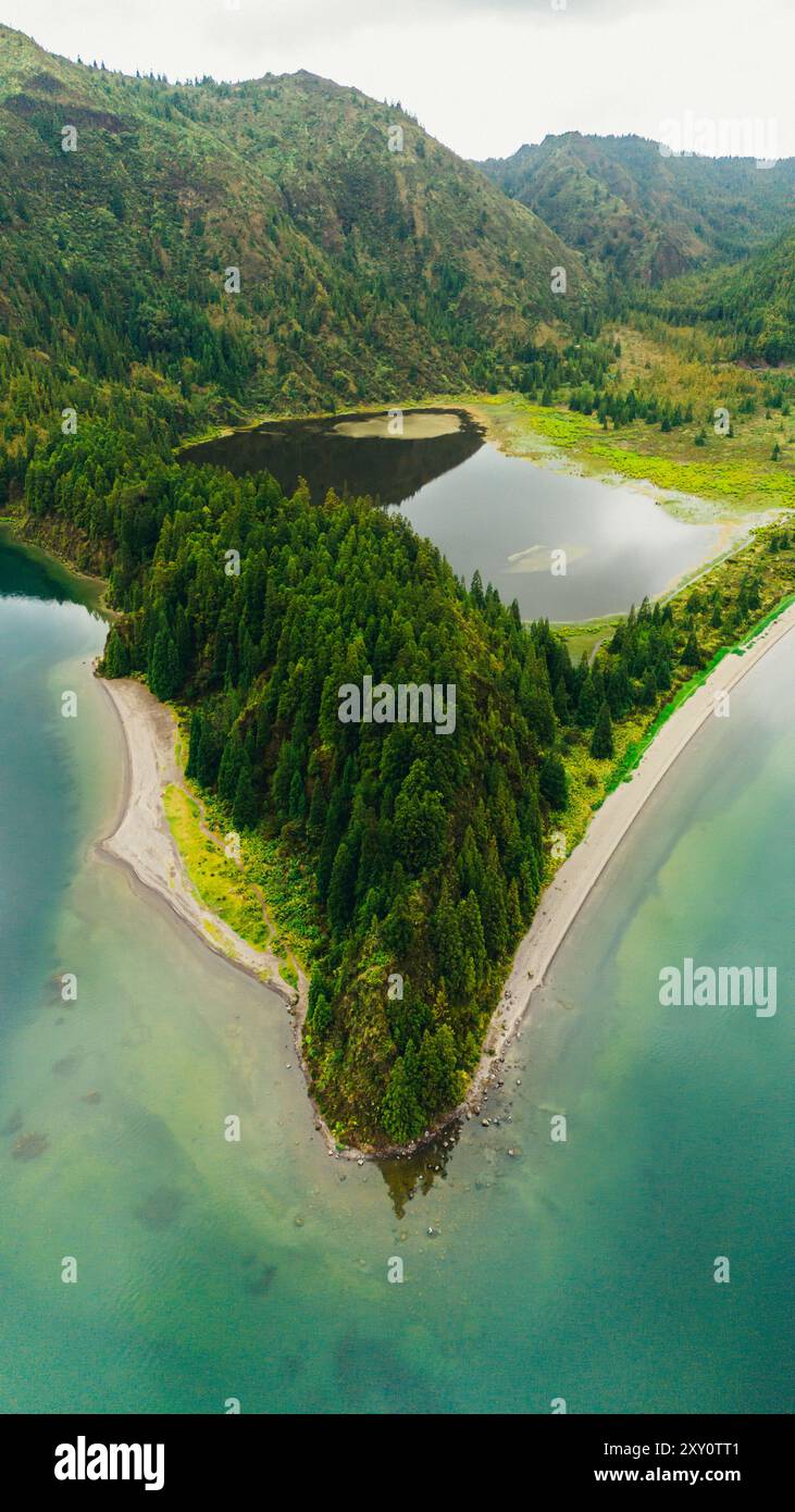 A stunning aerial photograph showcases a majestic lake surrounded by ...