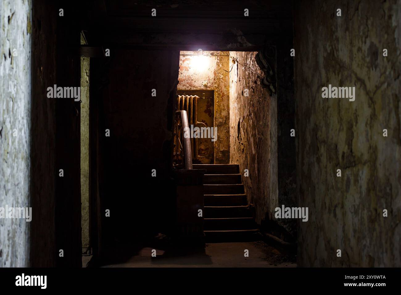 Exit from the basement to the stairs in an old gloomy building ...