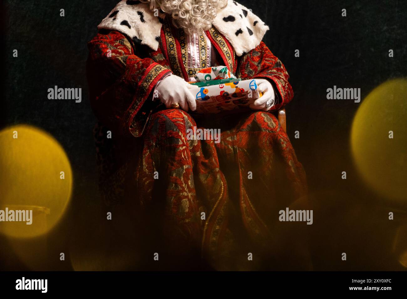 One of the wise men, dressed in traditional ornate robes and furs ...