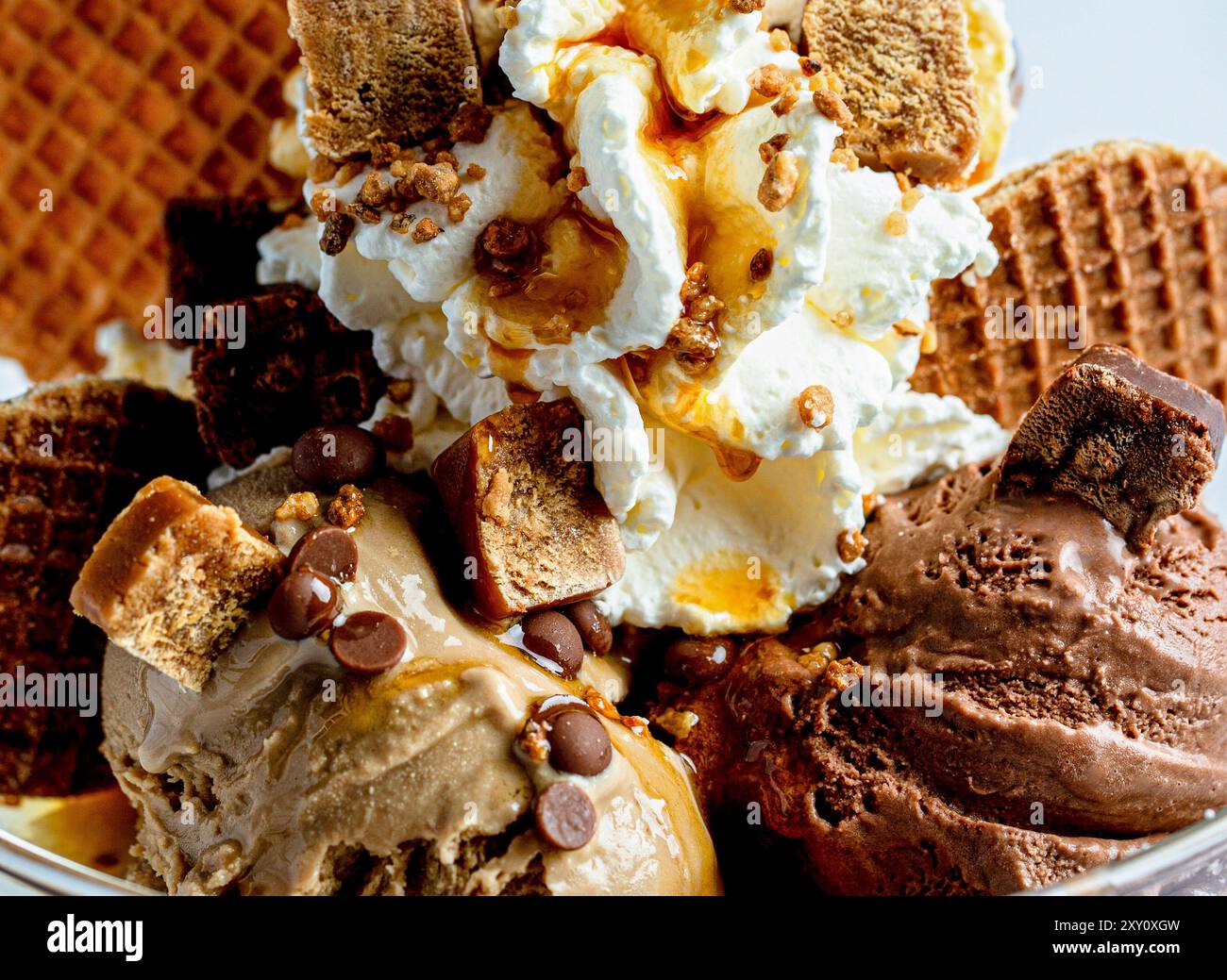A tempting ice cream sundae featuring scoops of rich chocolate and ...