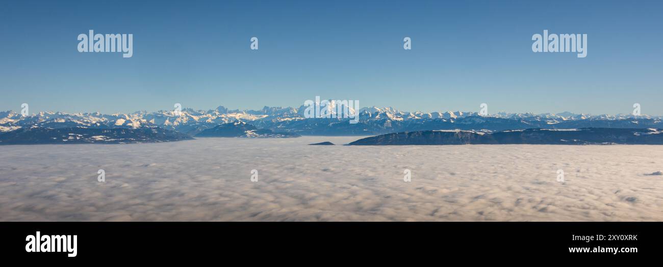 A breathtaking panorama showing a vast sea of clouds beneath a clear ...