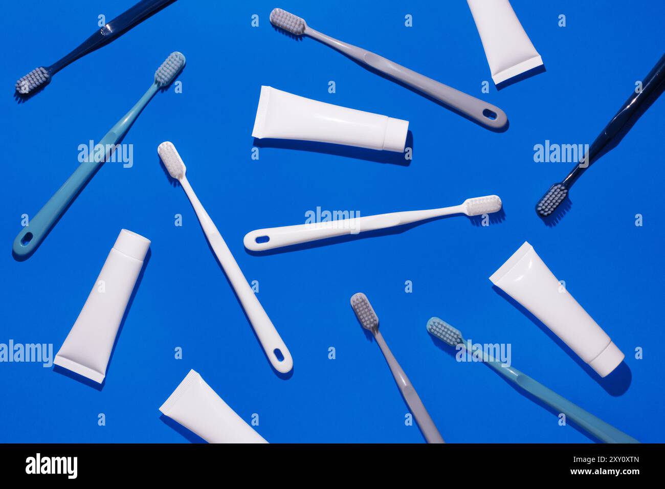 An array of dental hygiene items including toothbrushes and toothpaste ...