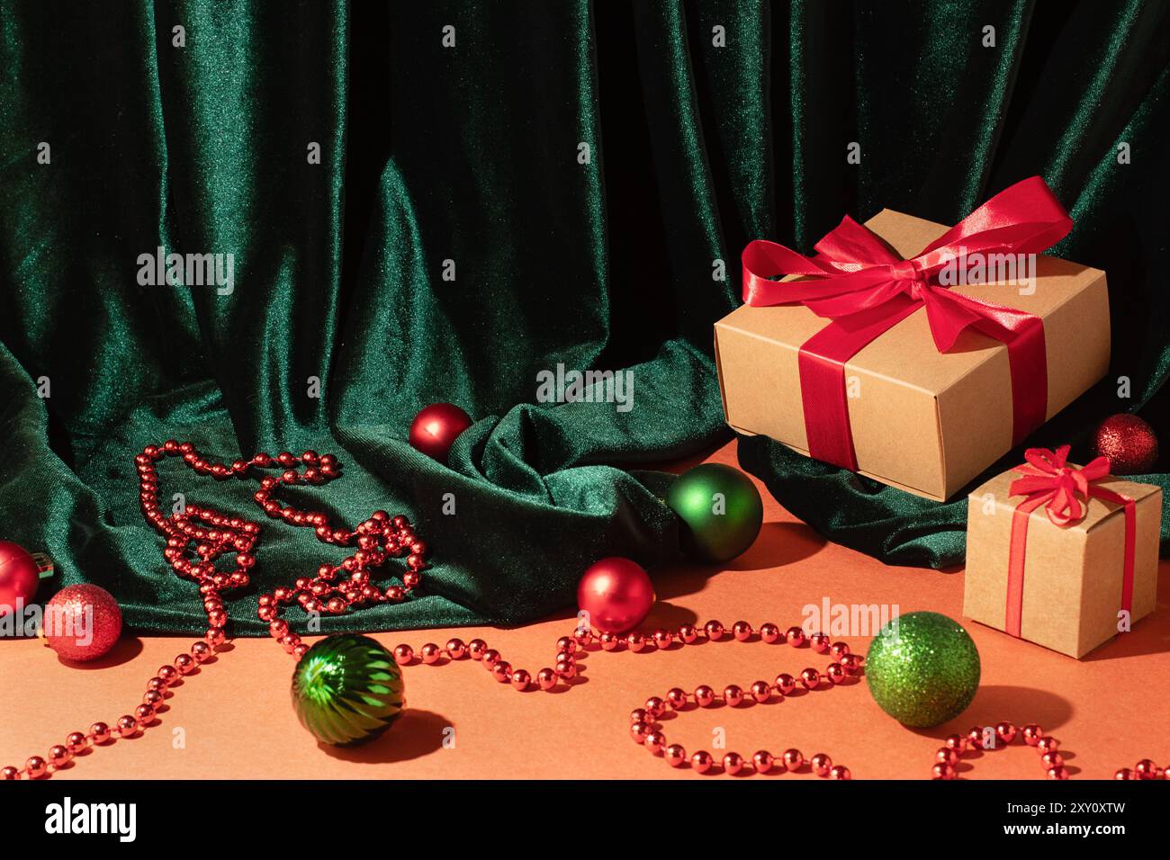 An elegant Christmas scene featuring gift boxes with red ribbons, shiny ...