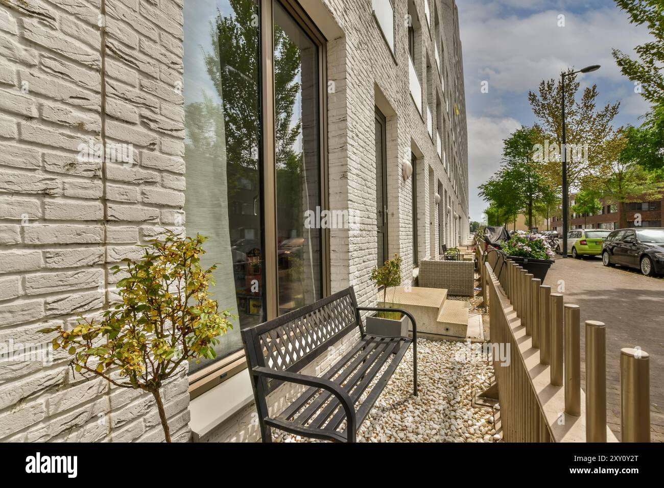 A contemporary street view showcasing a modern building with white ...
