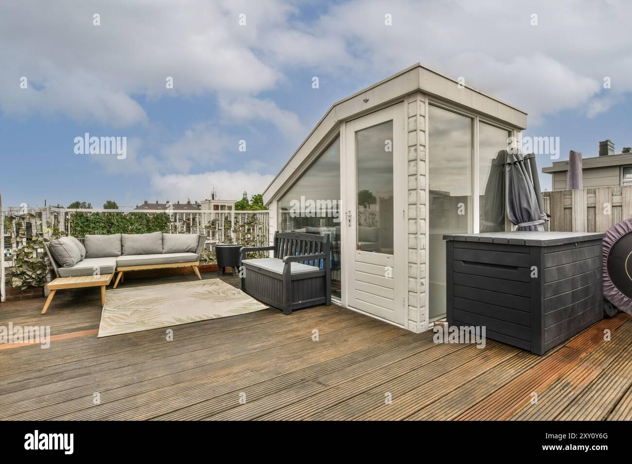 A stylish rooftop terrace featuring cozy outdoor furniture, decking ...