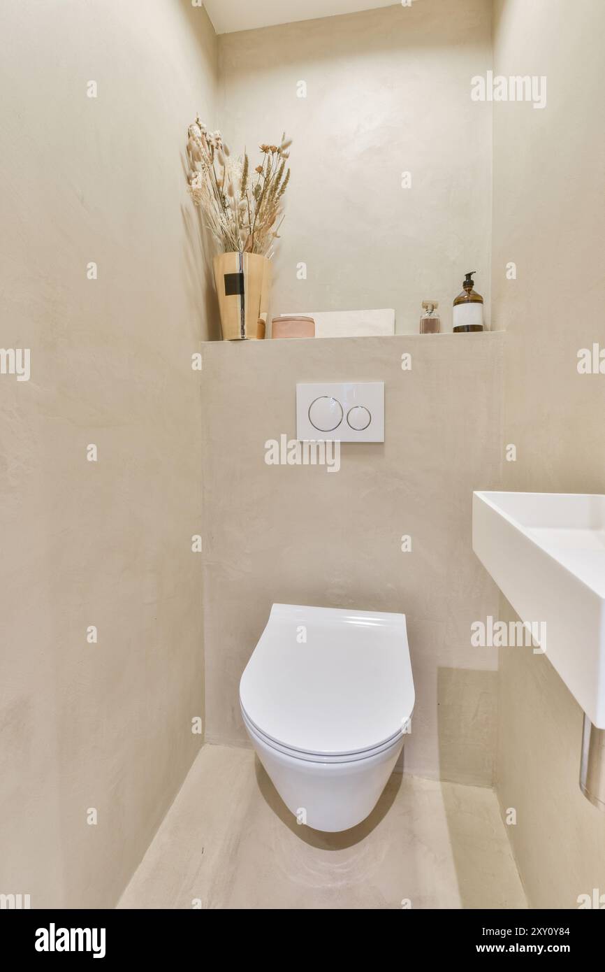 A contemporary bathroom showcases sleek design with a wall-mounted ...
