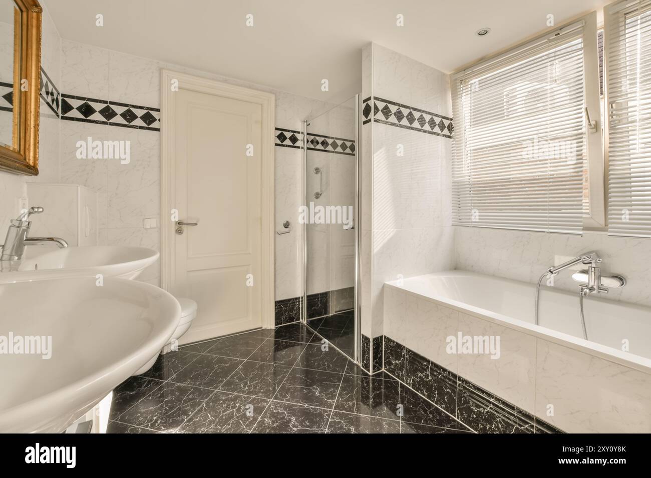 A sophisticated bathroom interior featuring marble walls, a glass ...