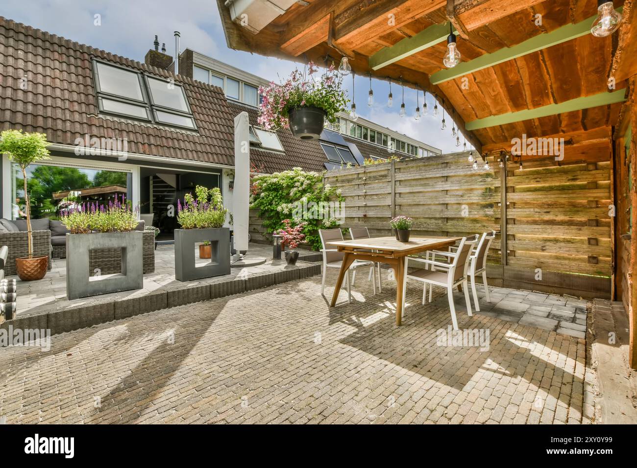 This image captures a cozy patio setup in a suburban setting with well ...
